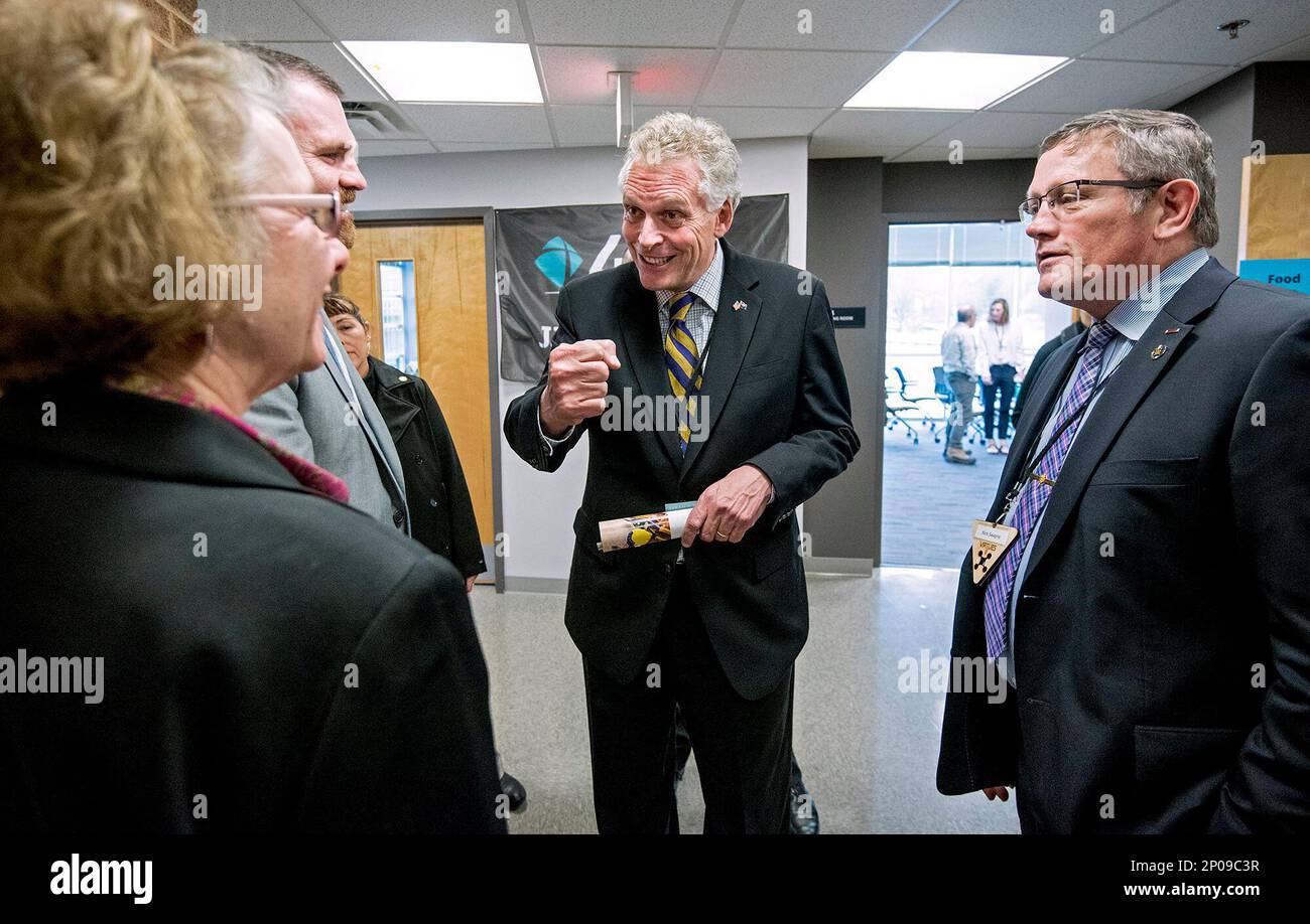 Virginia Gov. Terry McAuliffe, center, speaks with James Madison ...