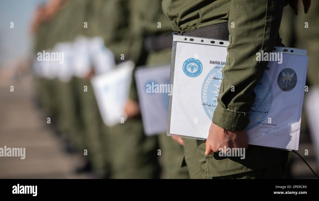 Syrian Internal Security Forces training academy members hold their ...