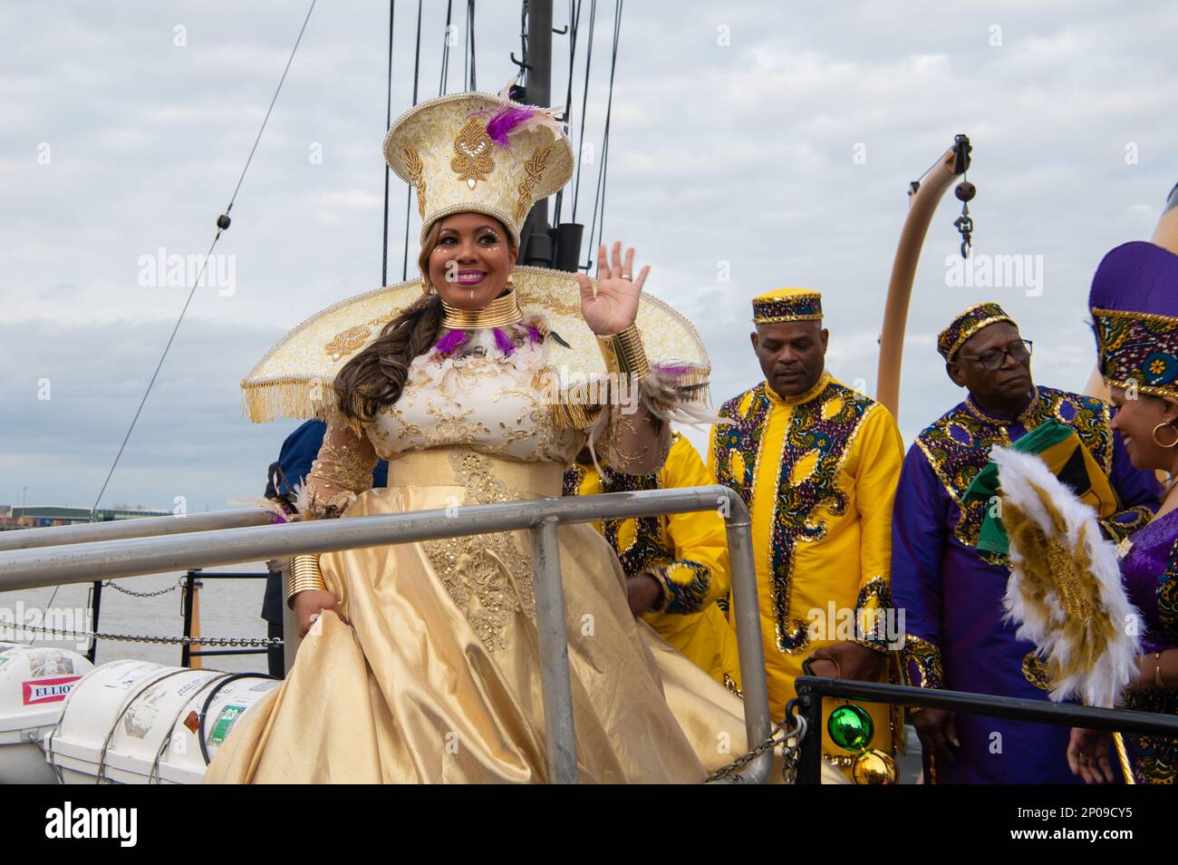 Queen of the Zulu Social Aid and Pleasure club waves as she walks off ...