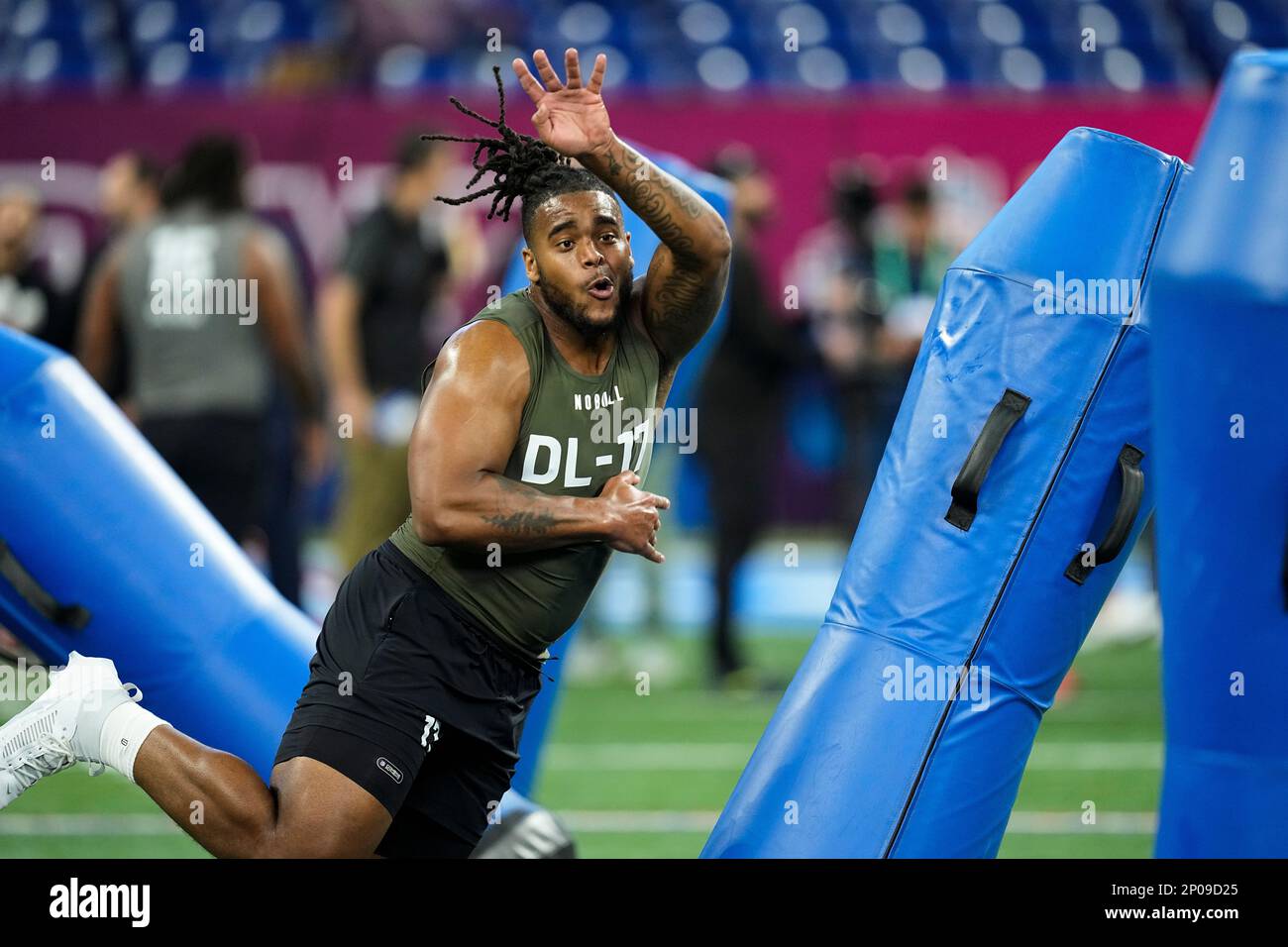 West Virginia defensive lineman Dante Stills runs a drill at the NFL ...