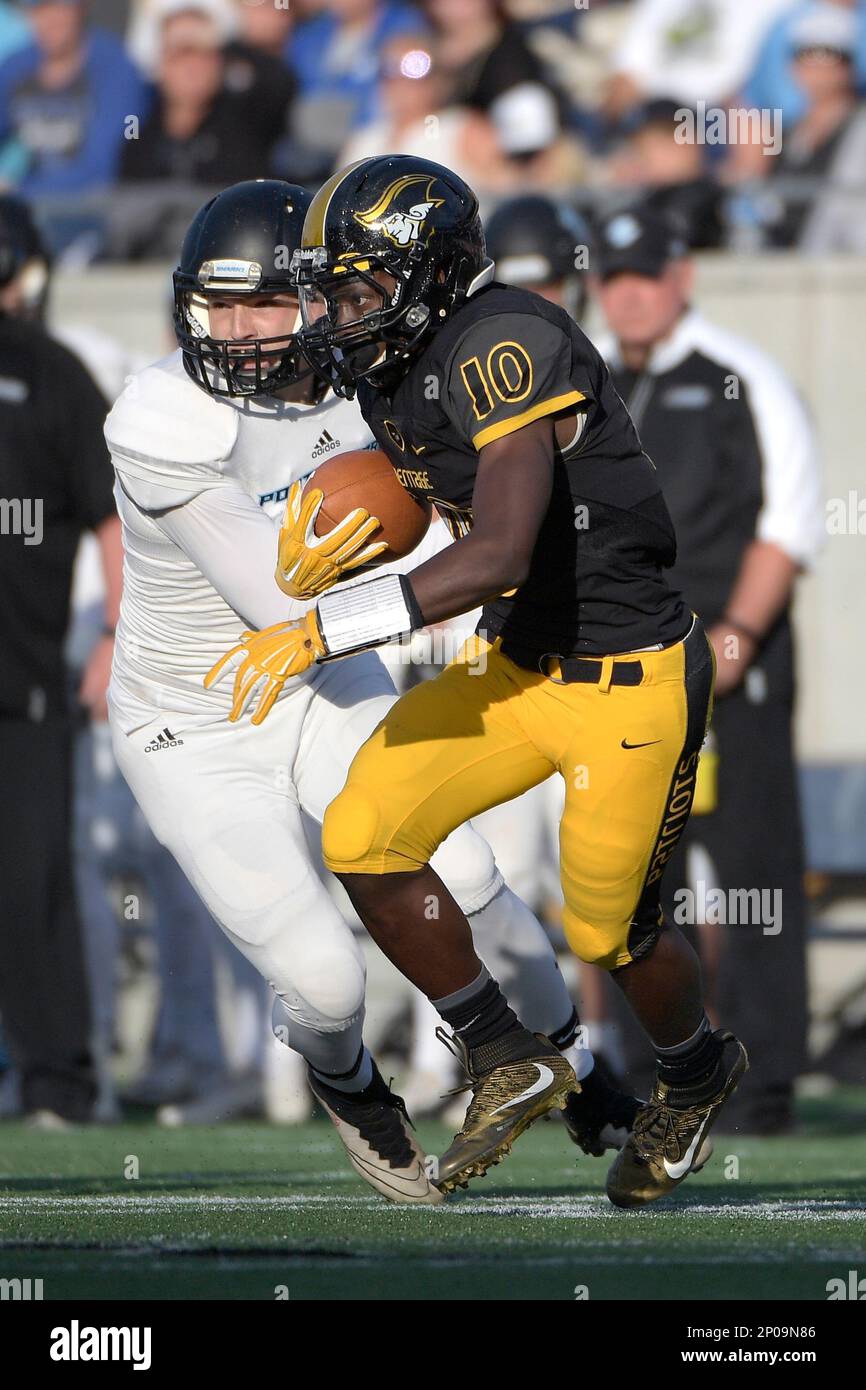 American Heritage running back Miles Jones (10) rushes for yardage ...
