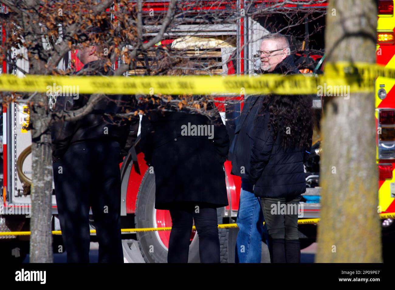 Rescue personnel work to free a subject who was crushed to death while ...