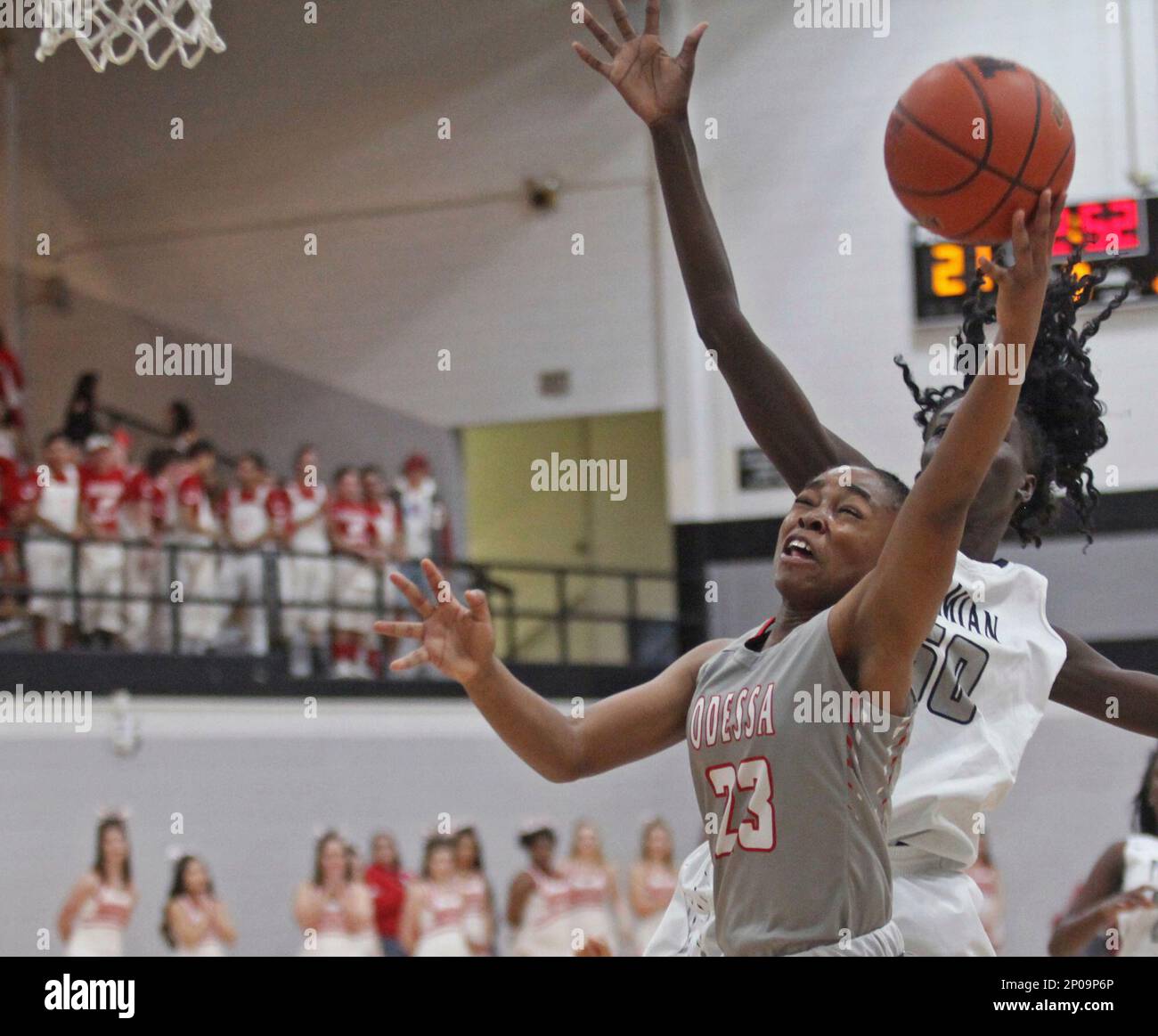 Odessa High Lady Bronchos' Ruthie Fox (23) attempts a layup as Permian ...