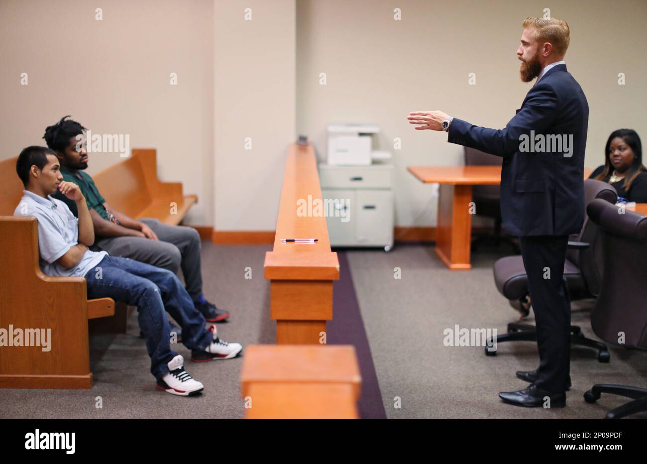 Lawyer David Lee Windecher speaks to a two young offenders, Luis Rangel ...