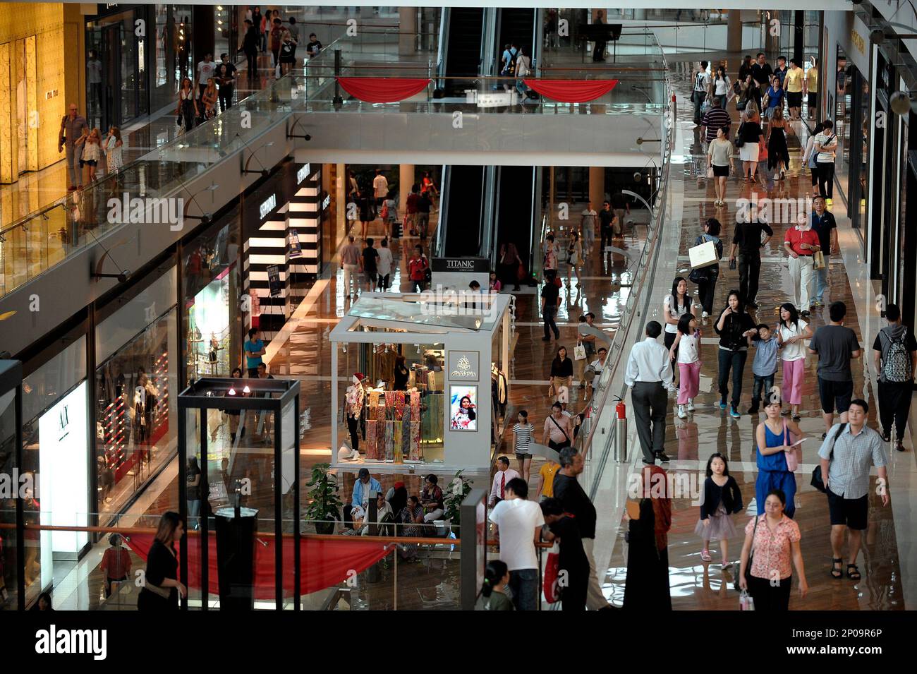 Interior of The Shoppes at Marina Bay Sands. It has makes the shopping ...