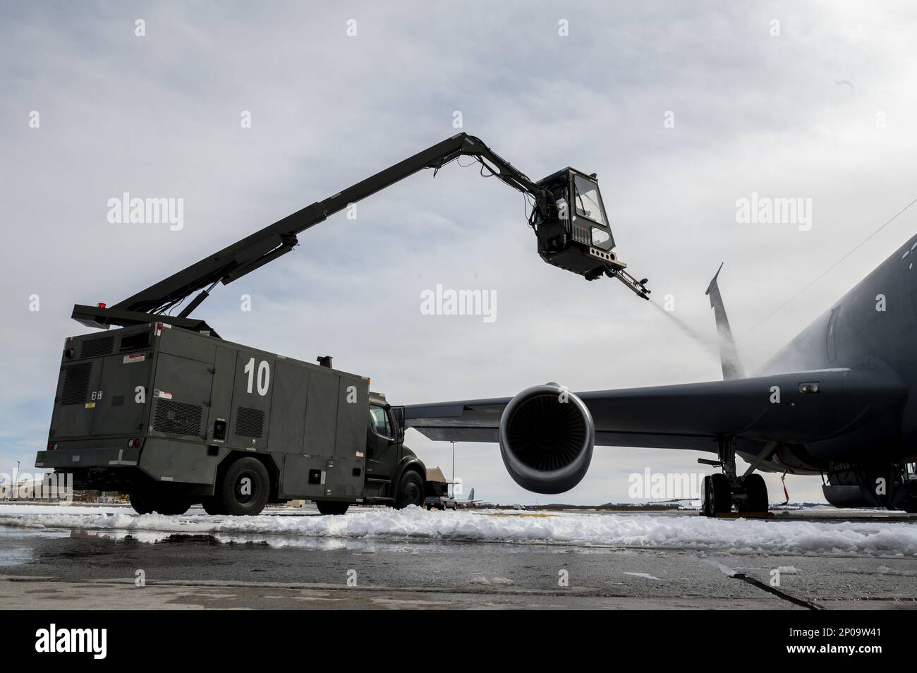 A U.S. Air Force KC-135 Stratotanker is deiced by Airmen from the 92nd ...
