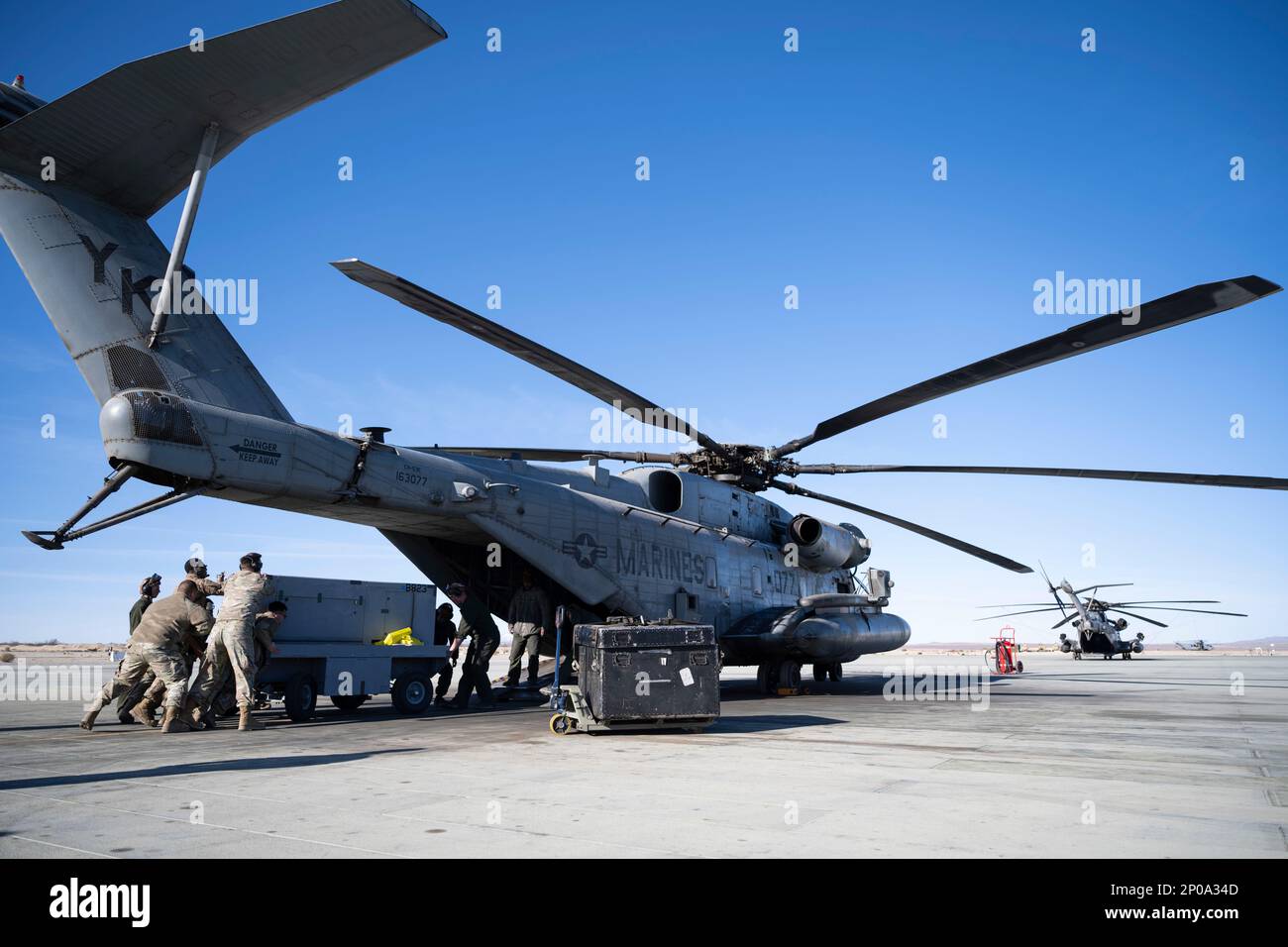 Airmen from the 9th and 29th Aircraft Maintenance Units load a hybrid ...