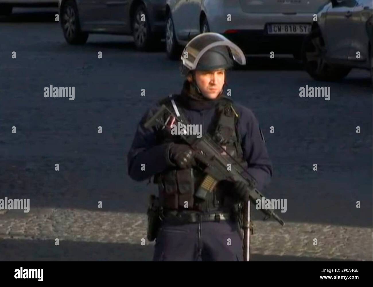 In this image made from video, a security official stands guard outside ...