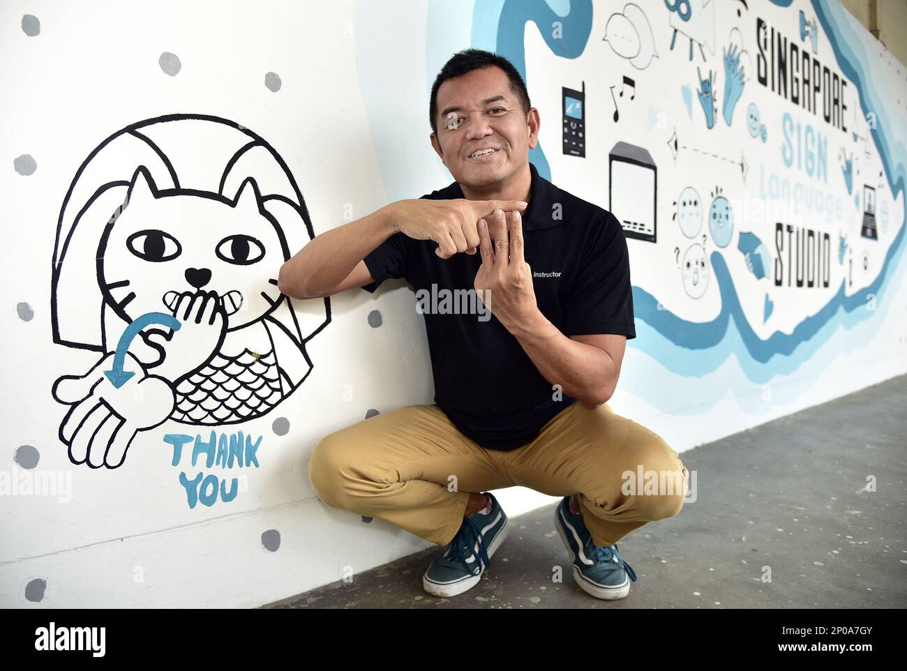 Pix of Mr James Ong, a sign language instructor showing how to sign ...