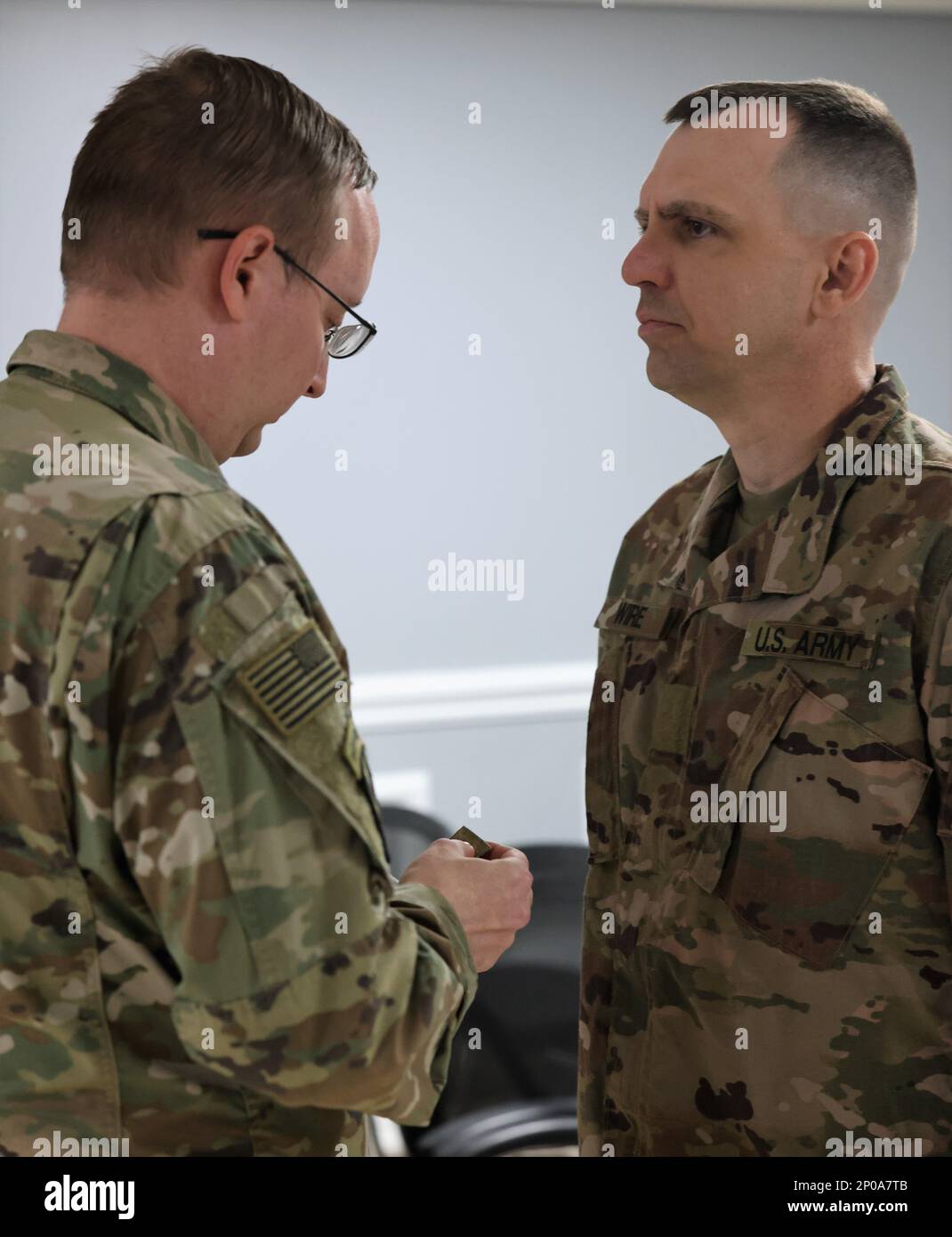 Mark Wire, of Area Support Group - Kuwait, gets promoted by Maj. Andrew ...