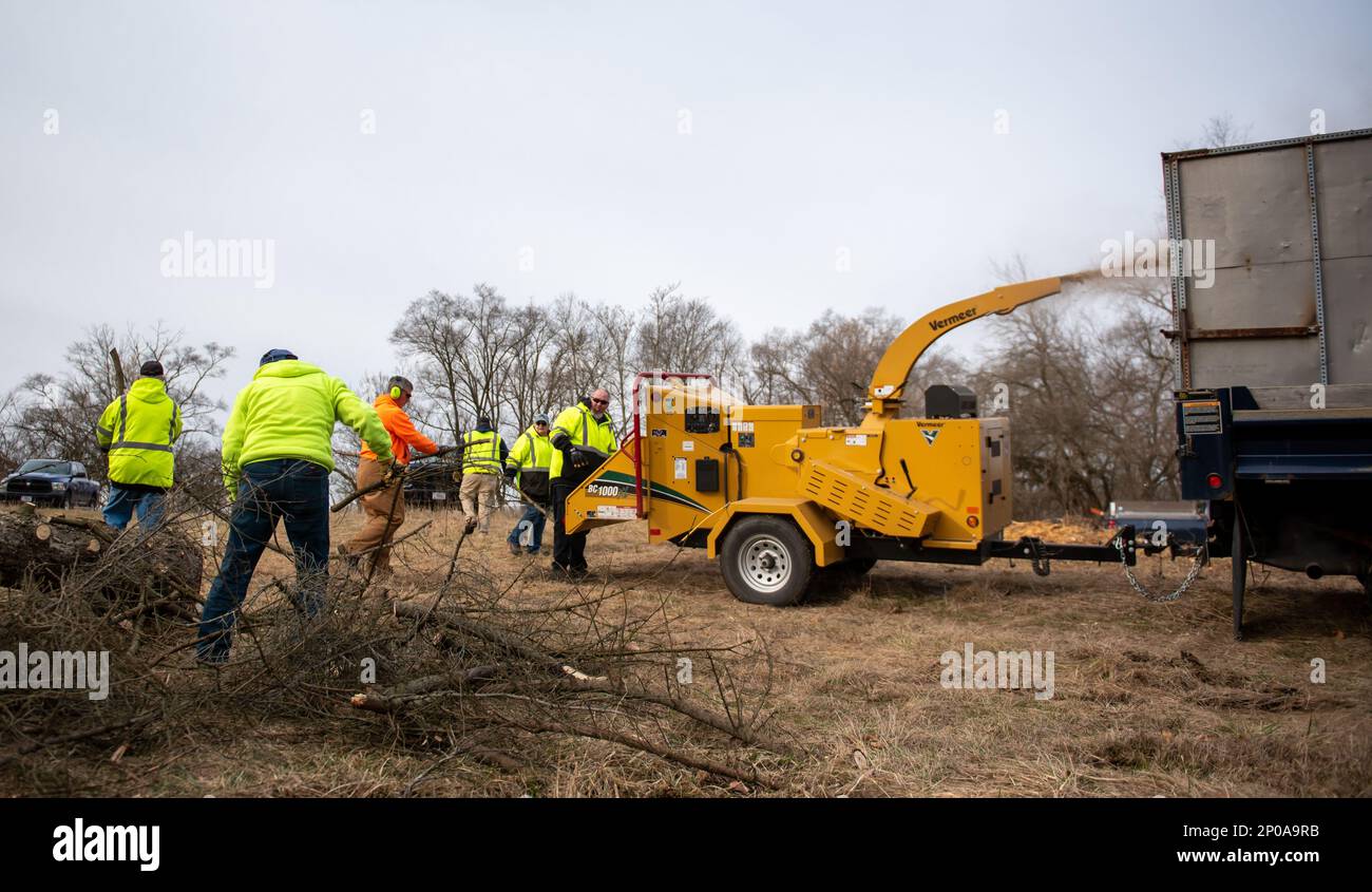 Ground crew personnel from the 88th Civil Engineer Group pick up tree ...
