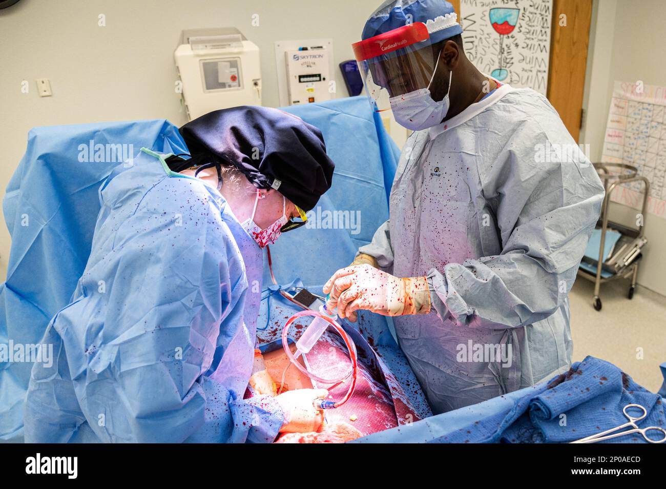 Instructors act as surgeons during a mock surgery while 68D operating ...