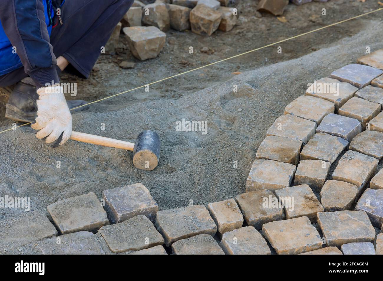 Paving of street with granite stones was laborious task that required ...