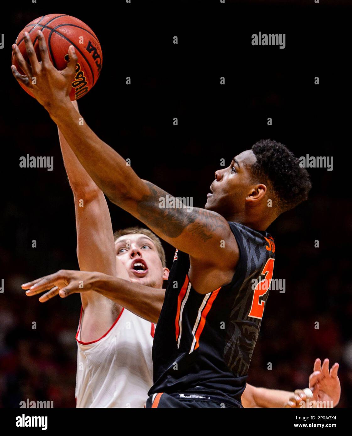 Oregon State guard Ronnie Stacy (2) is defended by Utah forward Tyler ...