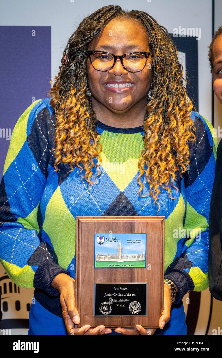 Sara Brown shows the plaque she earned for being named Walter Reed ...