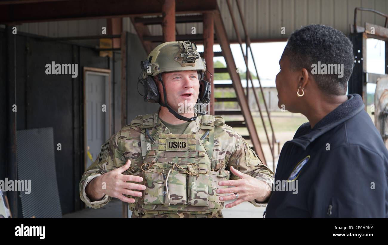 U.S. Coast Guard Master Chief Petty Officer Kelly Tumlinson, left, of ...