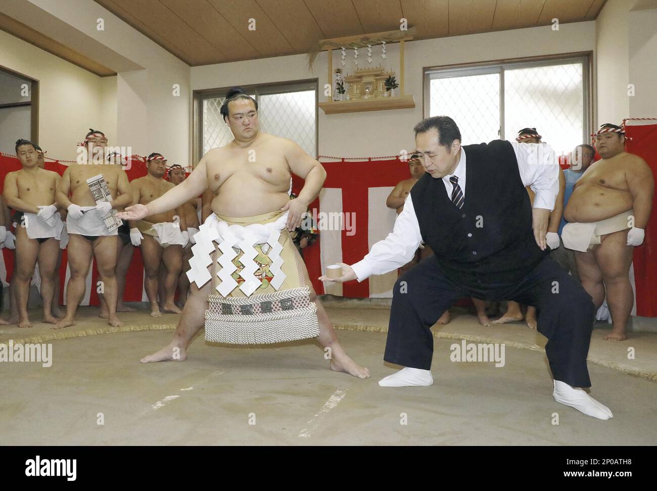 Newly yokozuna promoted Kisenosato (front L) receives a lecture how to ...