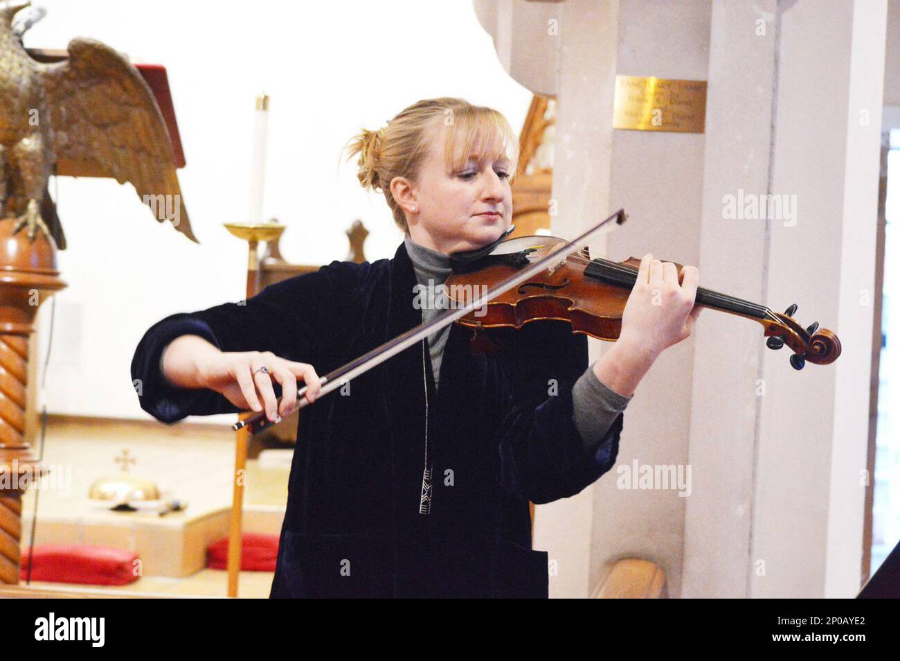 Violinist Rachel Krieg was among three musicians playing during an ...
