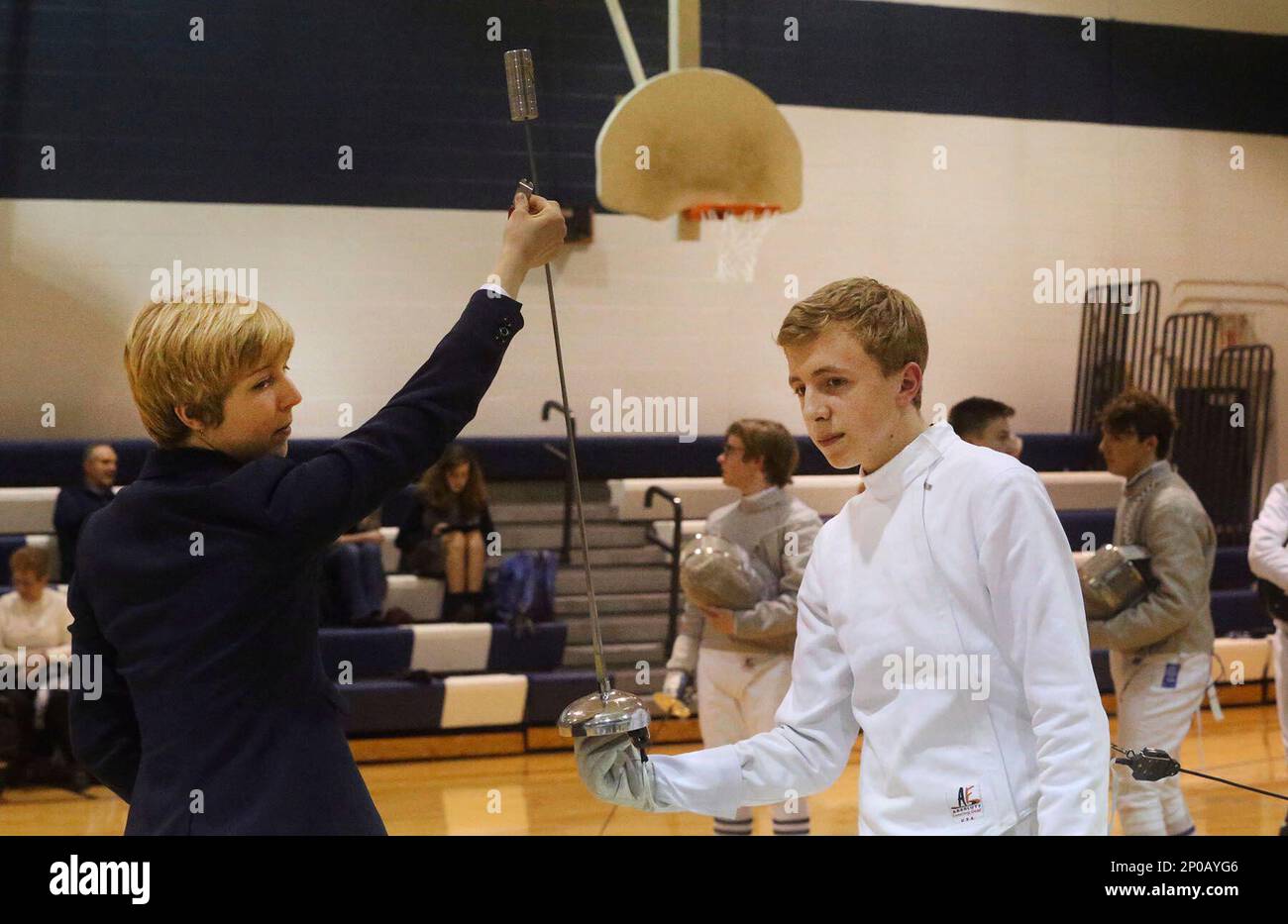Match official Lindsay Stapleton of Philadelphia checks the foil of St ...