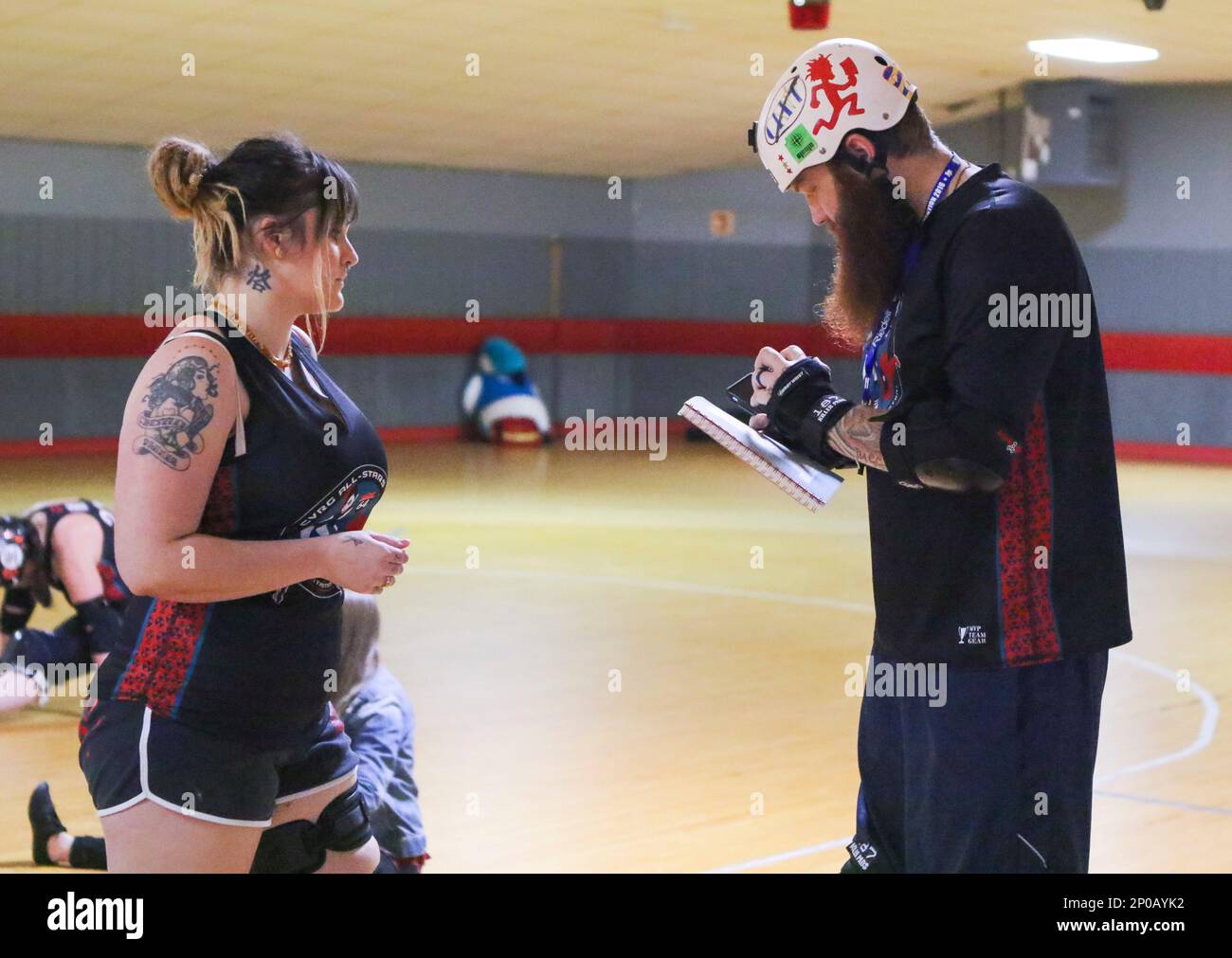 Chelsea "Dahmer" Fields talks with head coach Devin "Punch" Cordray ...