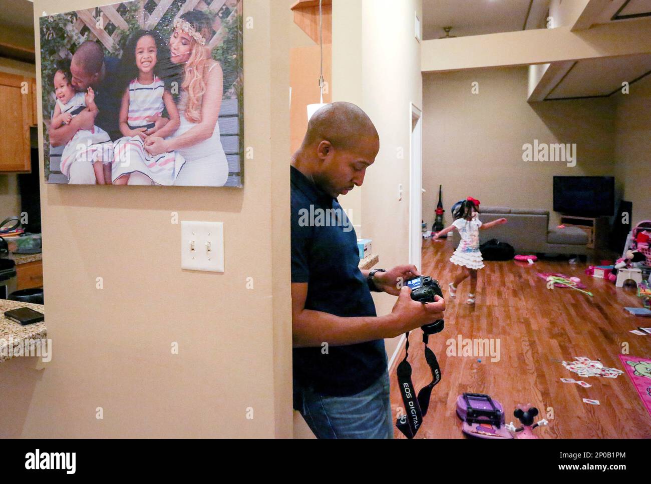 In a Thursday, Jan. 19, 2017 photo, Alex Hicks looks at a camera ...