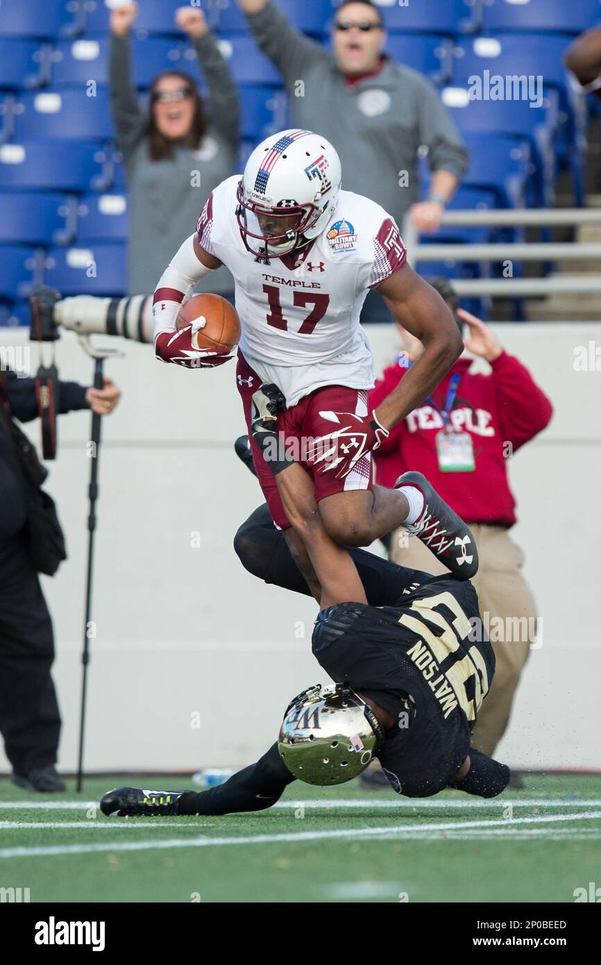 Adonis Jennings (17) of the Temple Owls catches a pass while being ...
