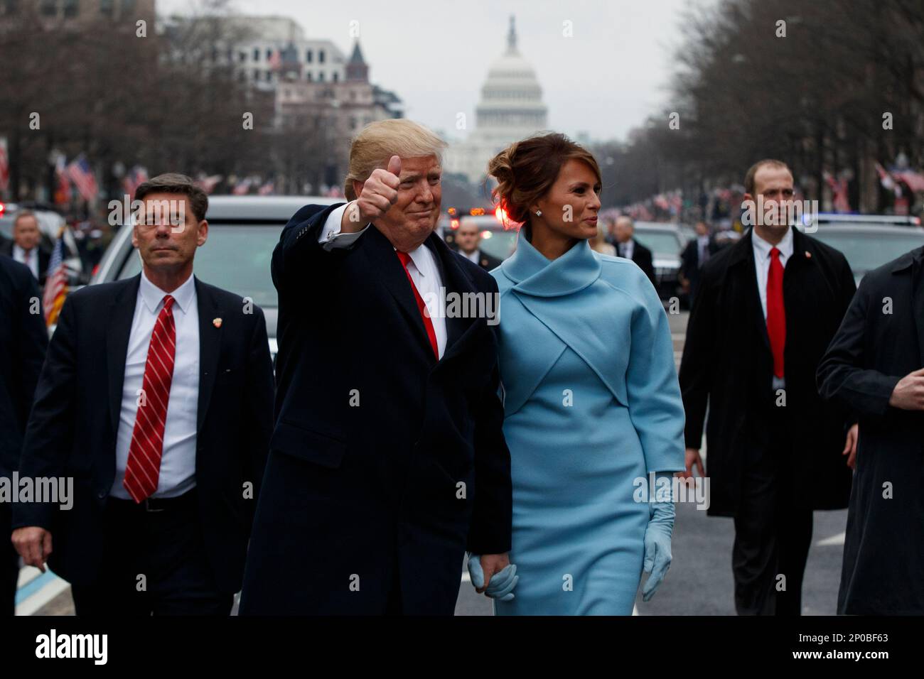 President Donald Trump and first lady Melania Trump walk along the ...