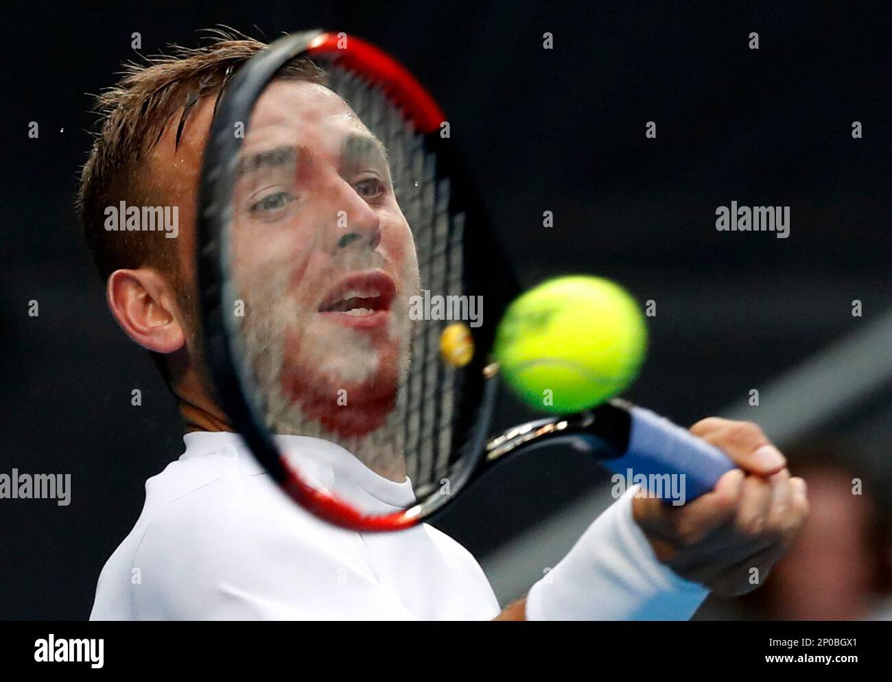 Britain's Daniel Evans hits a forehand return to Australia's Bernard ...