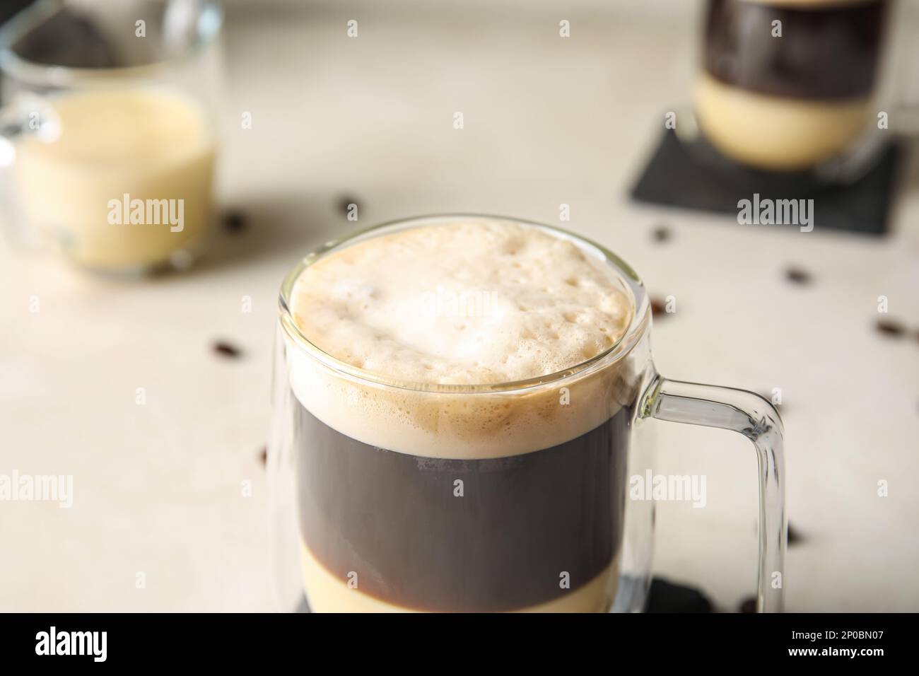 Cup of tasty Cafe Bombon on light table, closeup Stock Photo - Alamy