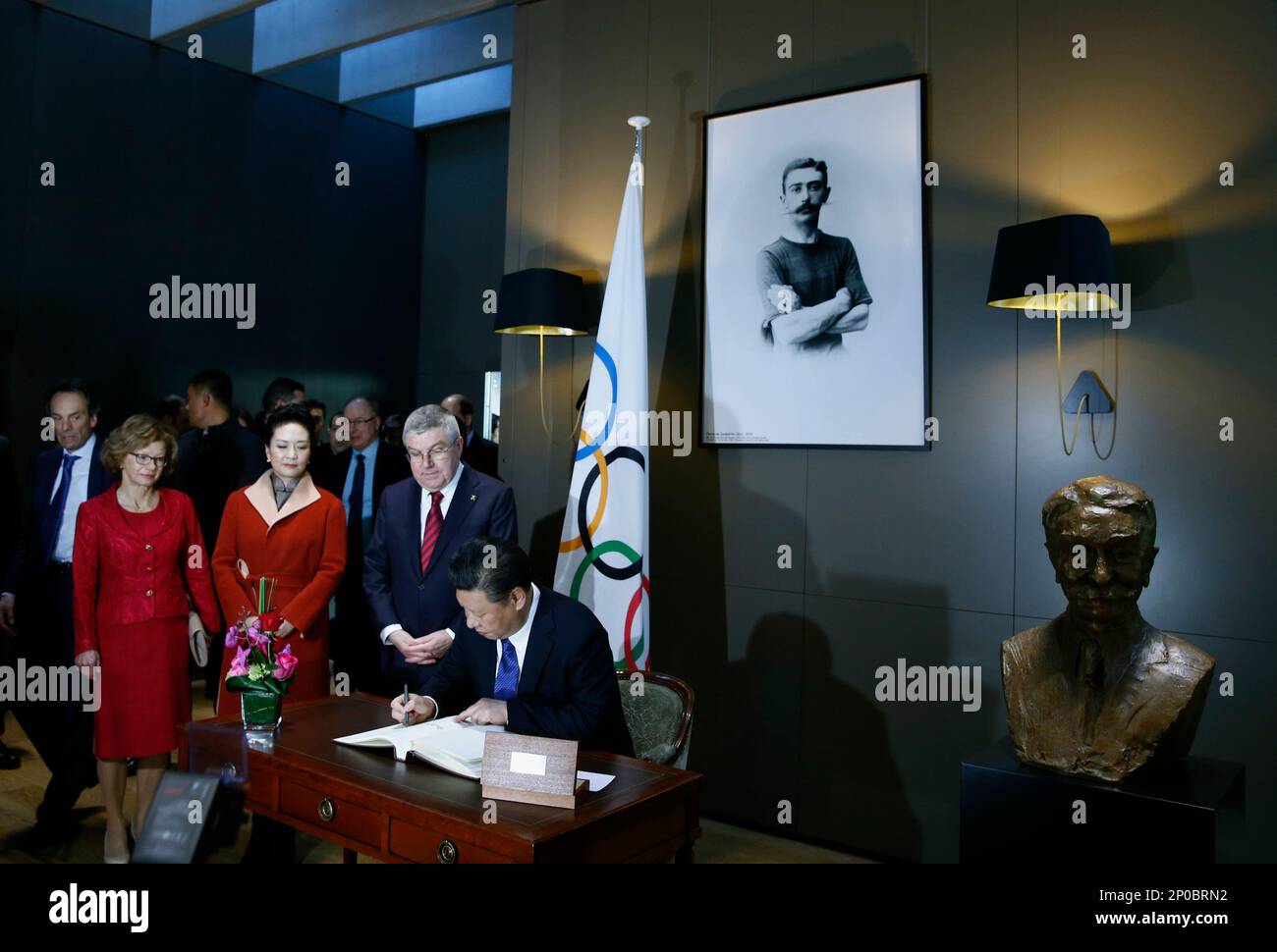 Chinese President Xi Jinping, right, signs the guest book next to his ...