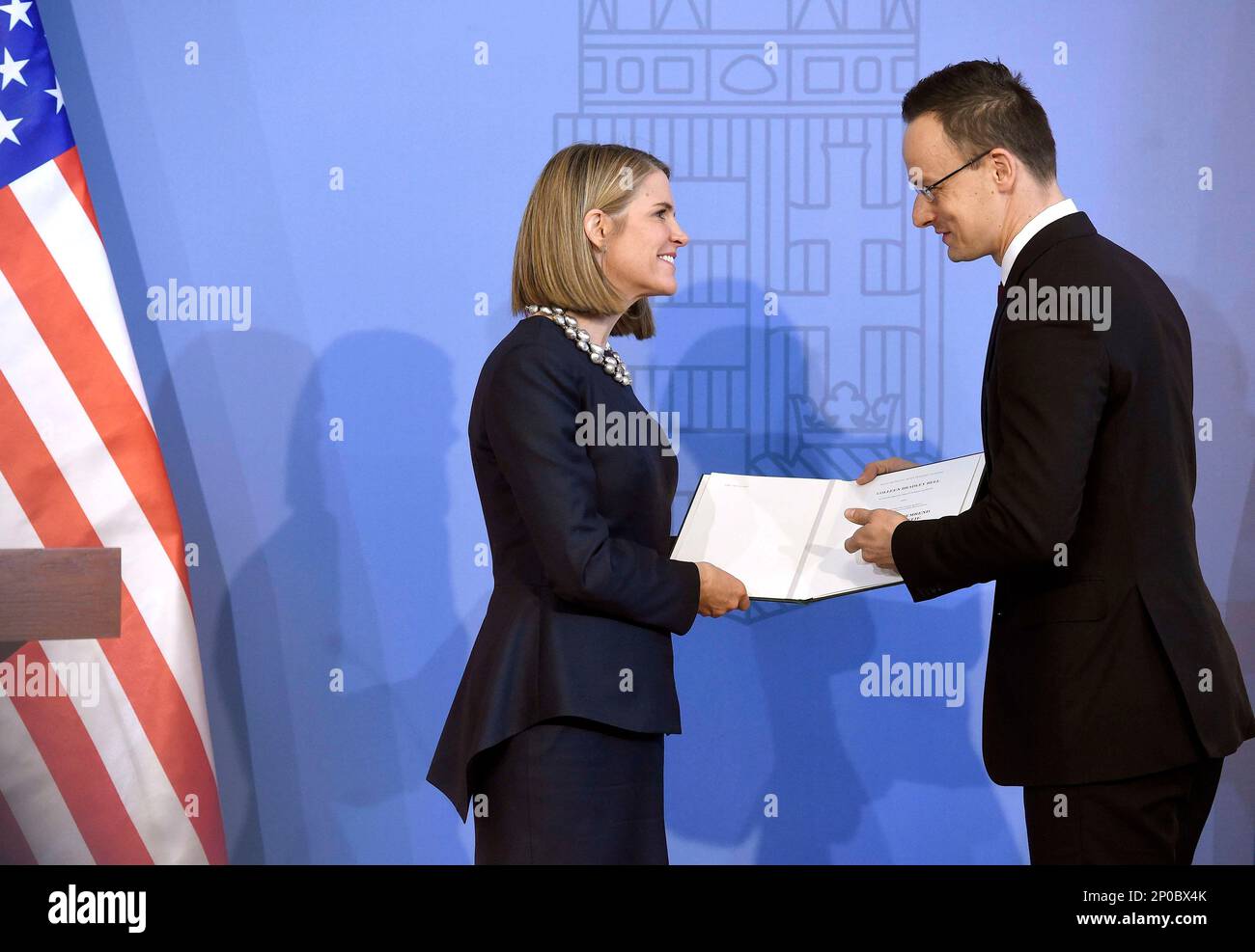 Outgoing US Ambassador to Hungary Colleen Bell, left, is being awarded ...