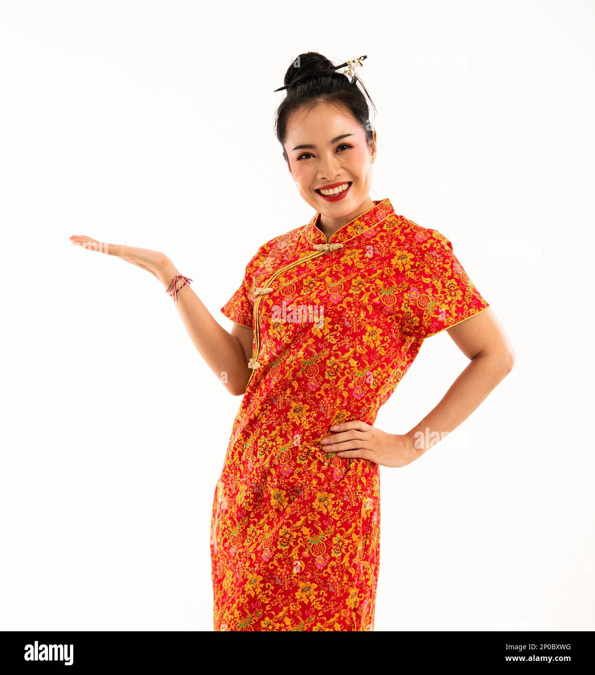 asian woman in cheongsam standing with one hand on her hips Stock Photo ...