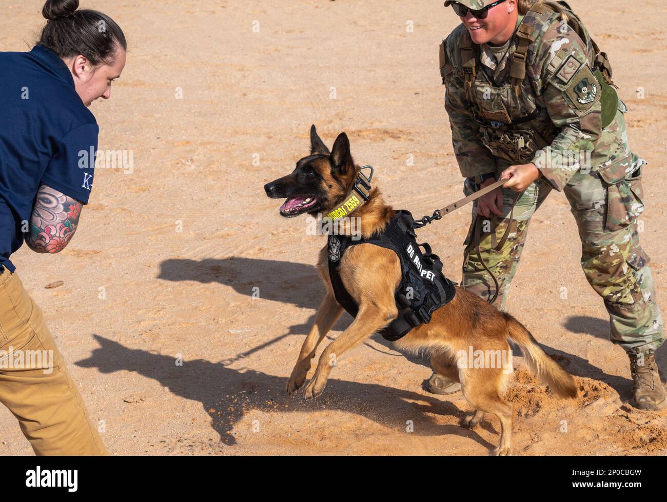 U.S. Air Force Staff Sgt. Jordan Courtney, right, and Sage Taylor, left ...