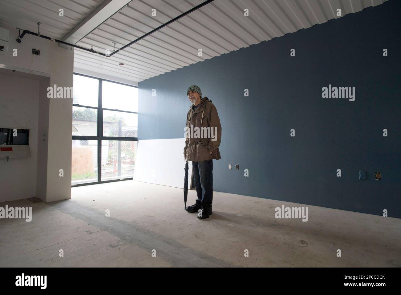 Army veteran Kenneth Salazar looks over one of the apartment units at ...