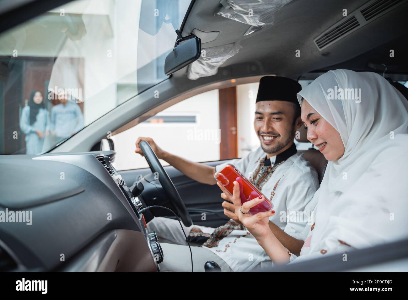 Malay family in car hi-res stock photography and images - Alamy