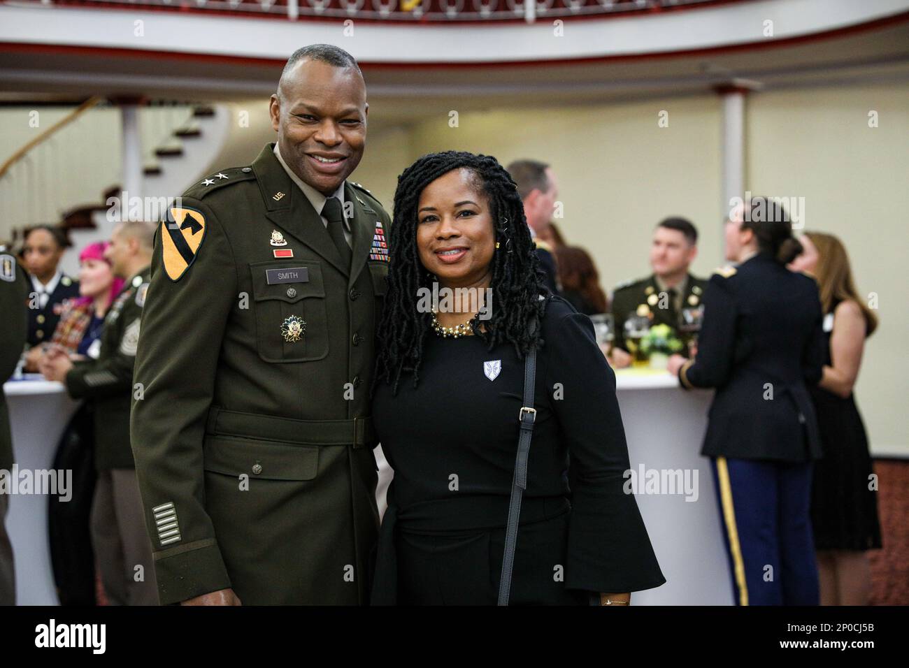 Maj. Gen. James Smith, commanding general, 21st Theater Sustainment Command, left, and spouse ...