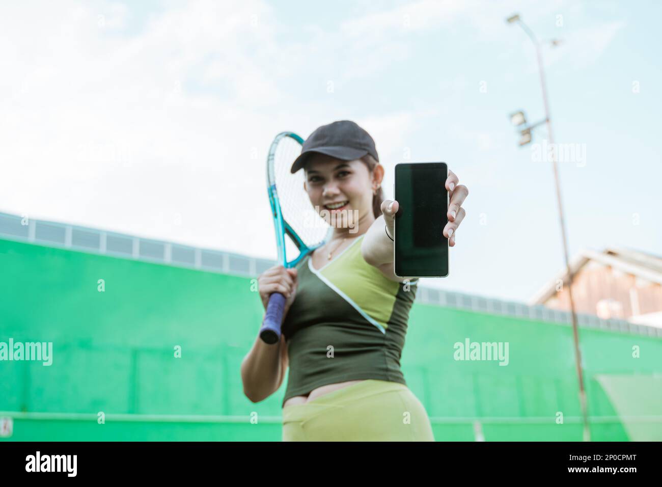bottom view of female tennis player showing mobile phone screen Stock ...