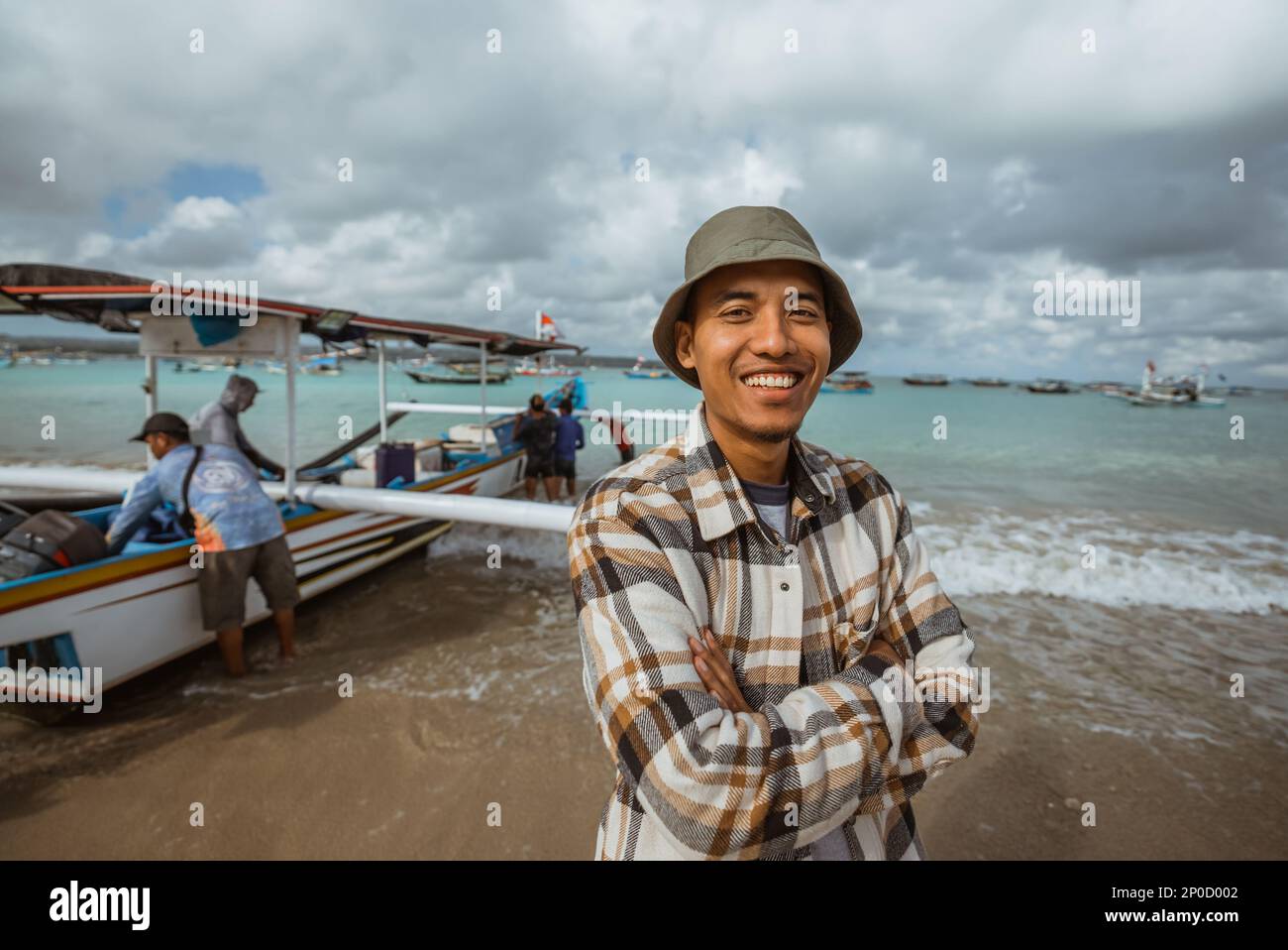 close up of Asian fisherman smiling with crossed hands Stock Photo - Alamy