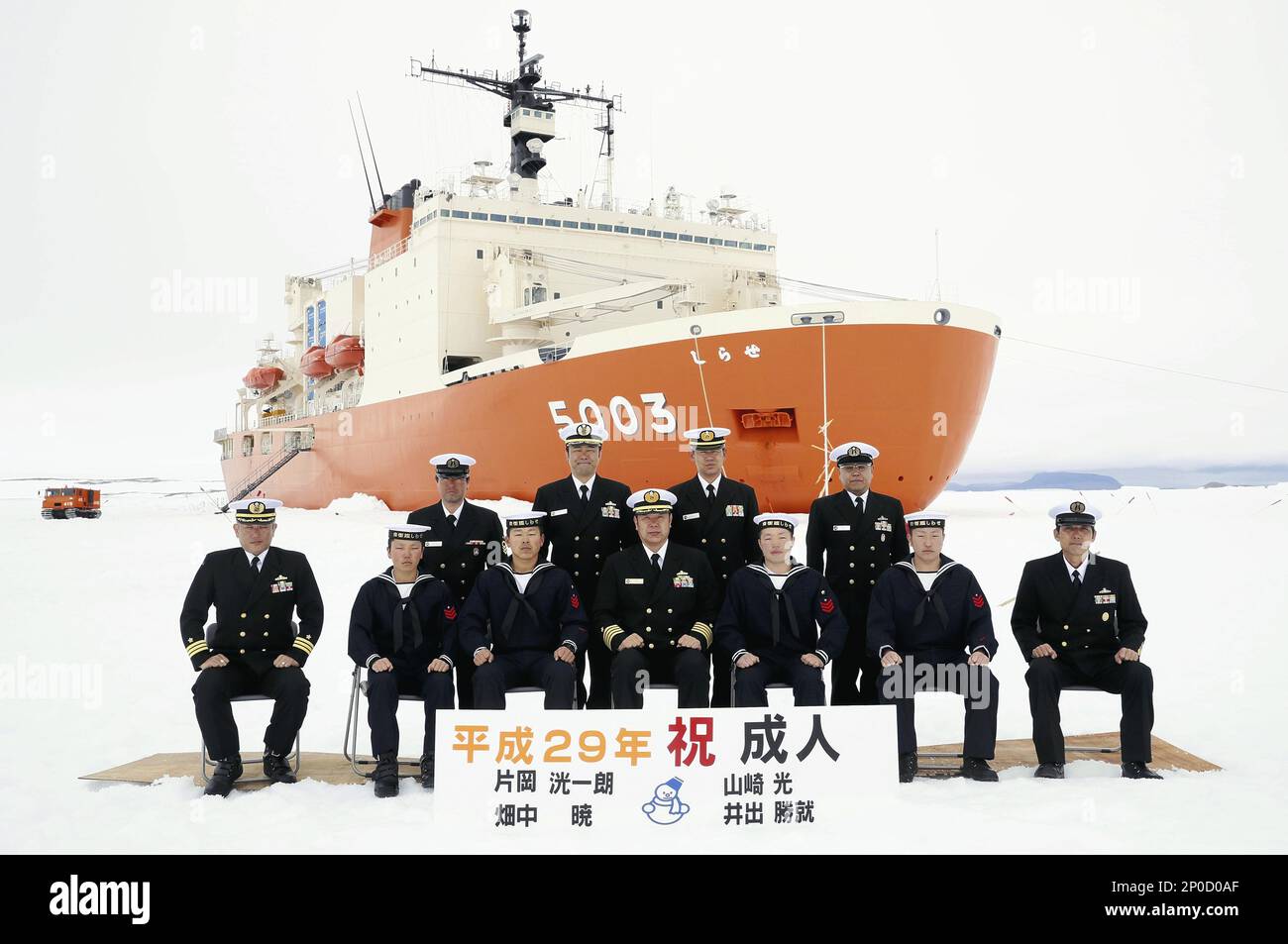 Crew members of Japanese icebreaker Shirase pose during the Coming-of ...