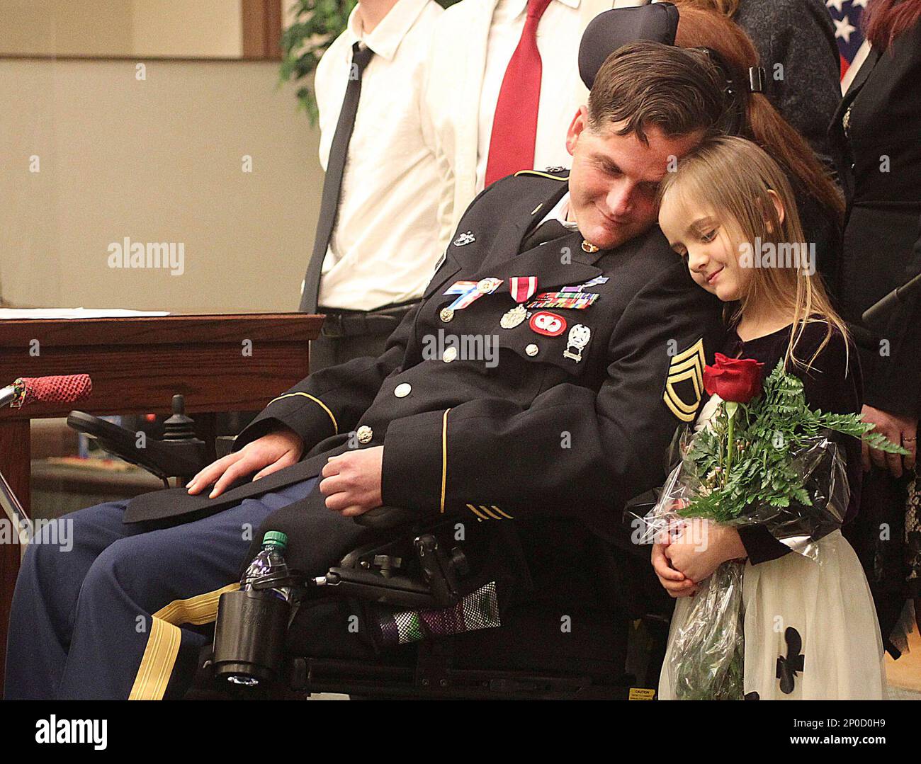 Sgt. 1st Class Joseph Lowrey touches foreheads with his 6-year-old ...