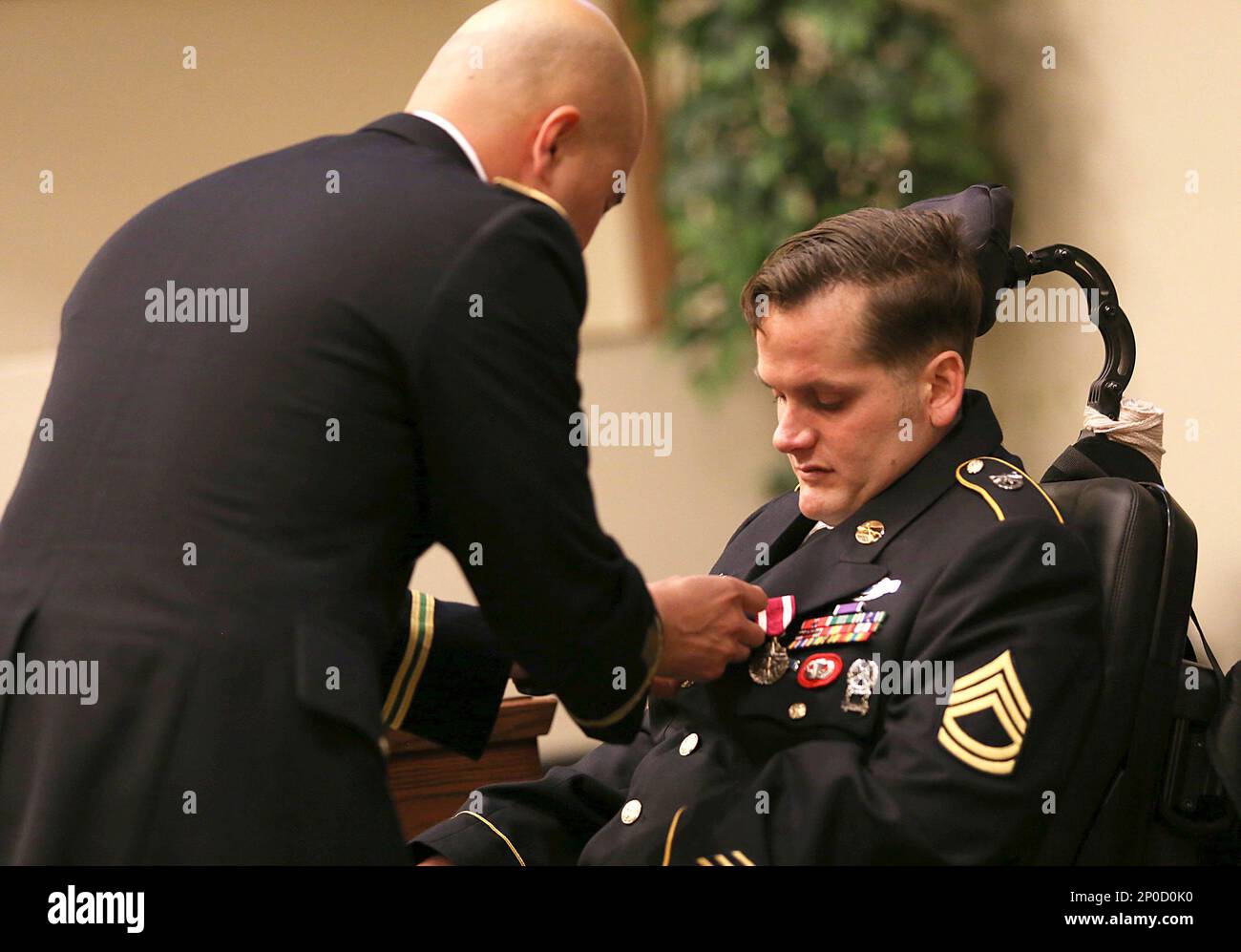 Battalion Commander LTC Varman Chhoeung pins a medal on Sgt. 1st Class ...