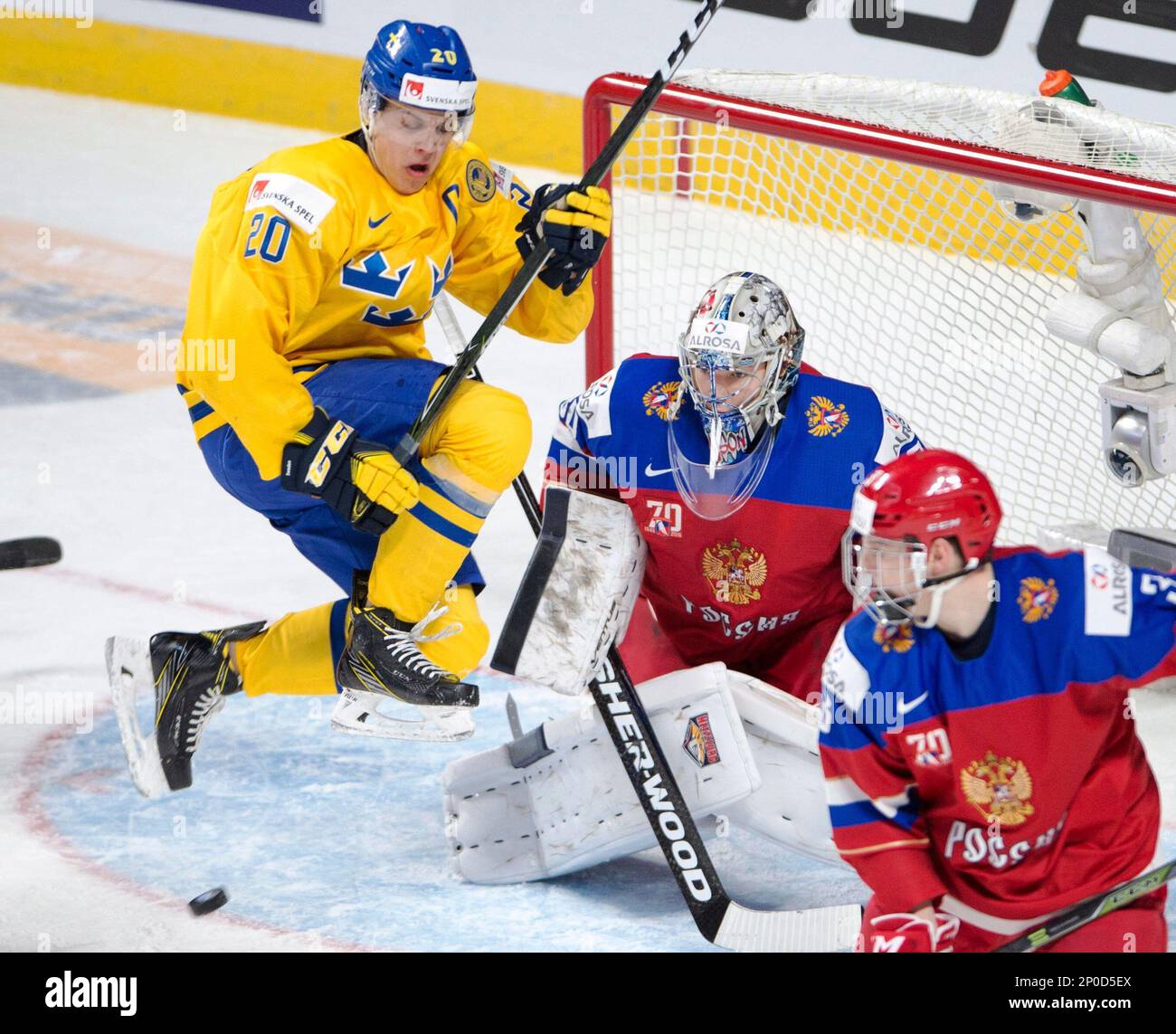 Sweden's Joel Eriksson Ek (20) jumps in front of Russia's goaltender Ilya Samsonov (30) as ...