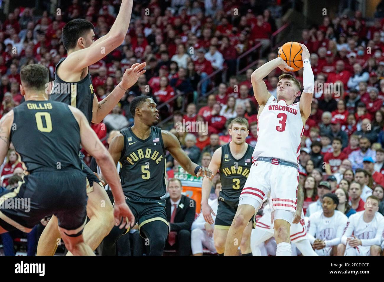 Wisconsin's Connor Essegian (3) shoots against Purdue's Zach Edey ...