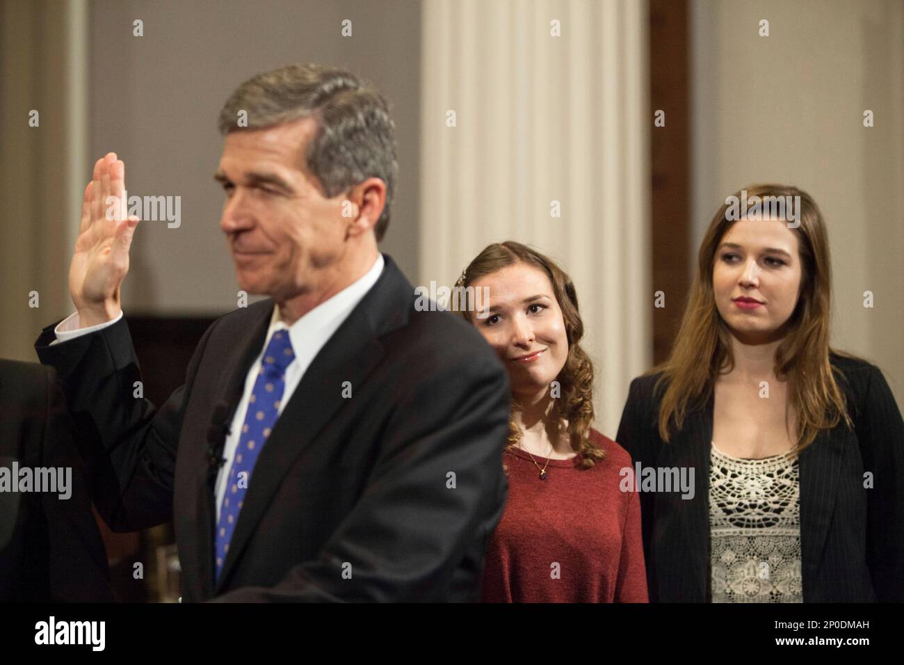 Roy Cooper is sworn in as North Carolina governor as his daughters ...