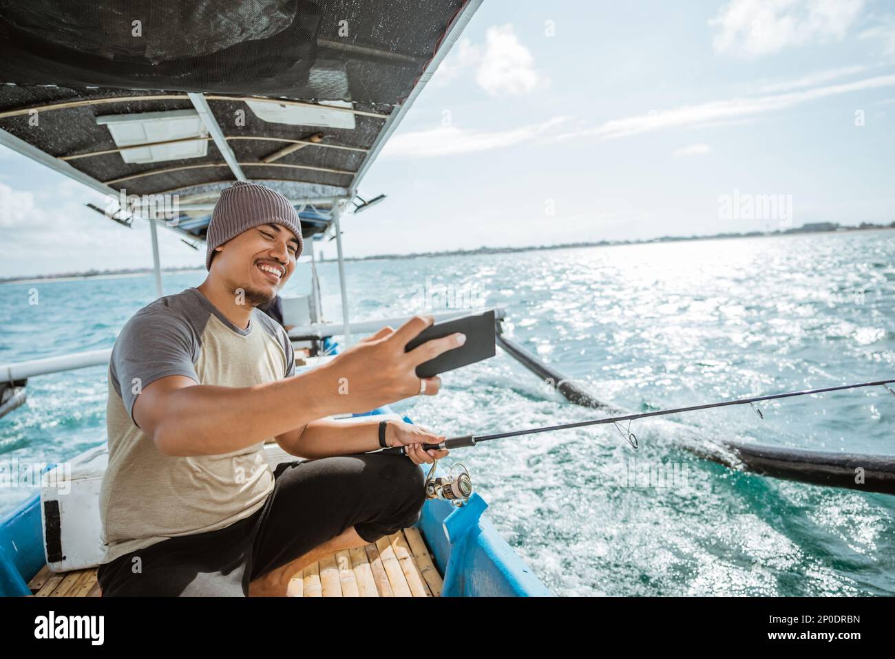 Fisherman taking fresh fish hi-res stock photography and images - Alamy