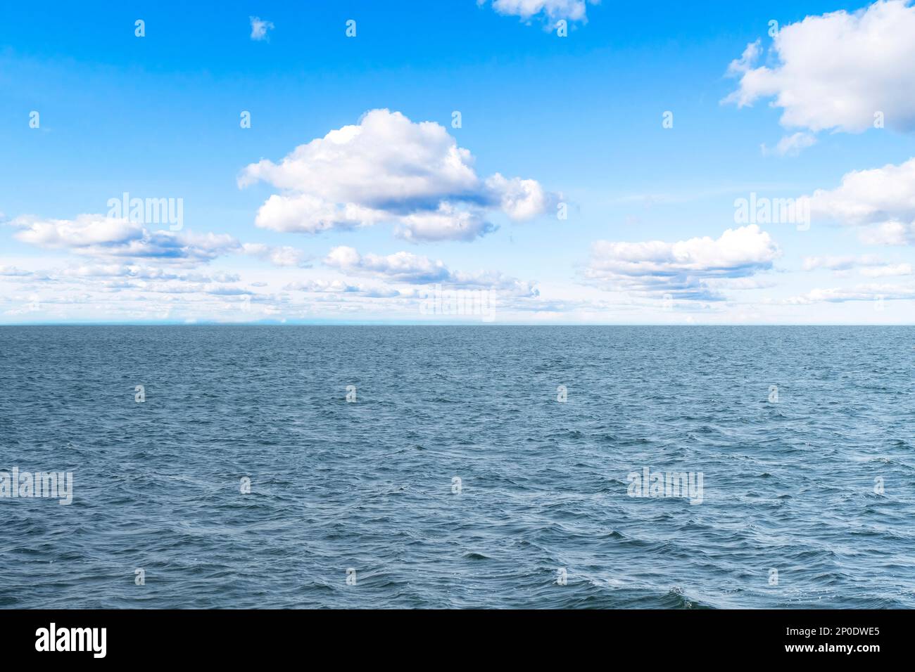 Aerial view of a blue sea water background and sun reflections. Aerial ...