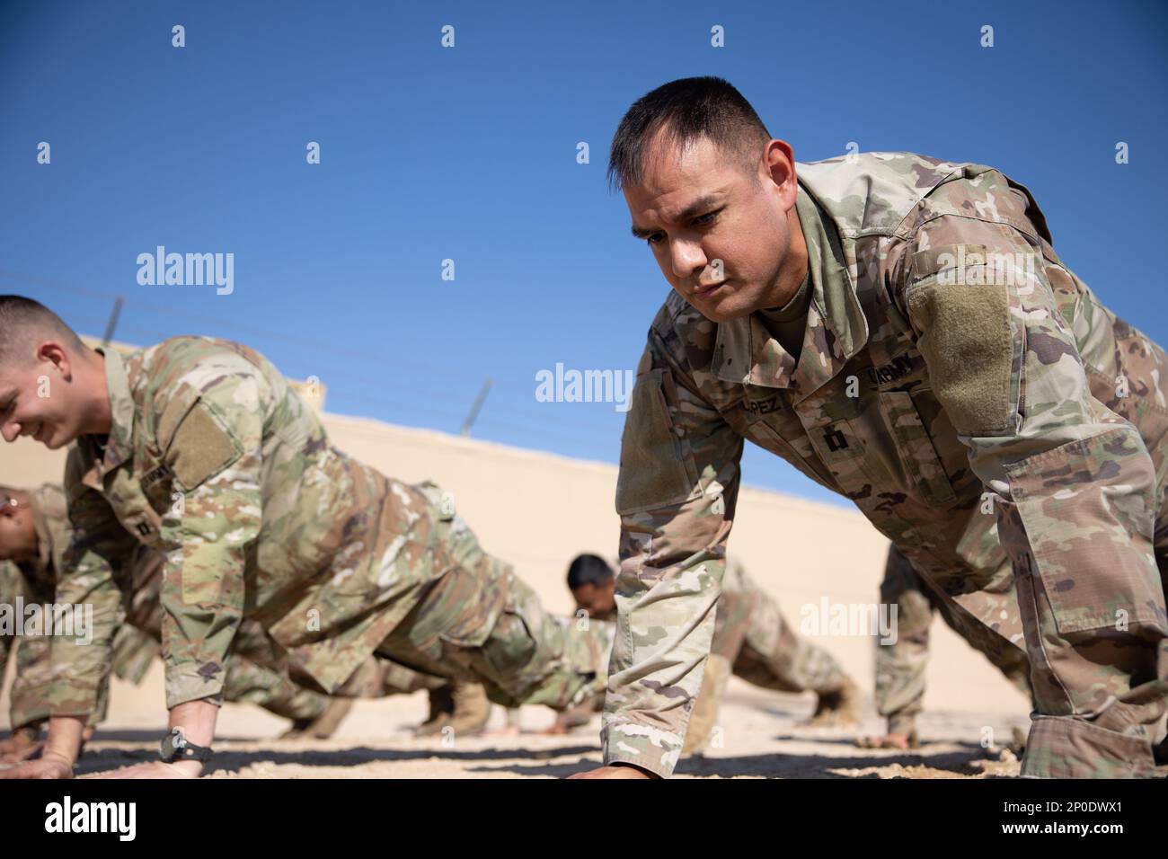 A U.S. Soldier, 1st Theater Sustainment Command, holds the front ...
