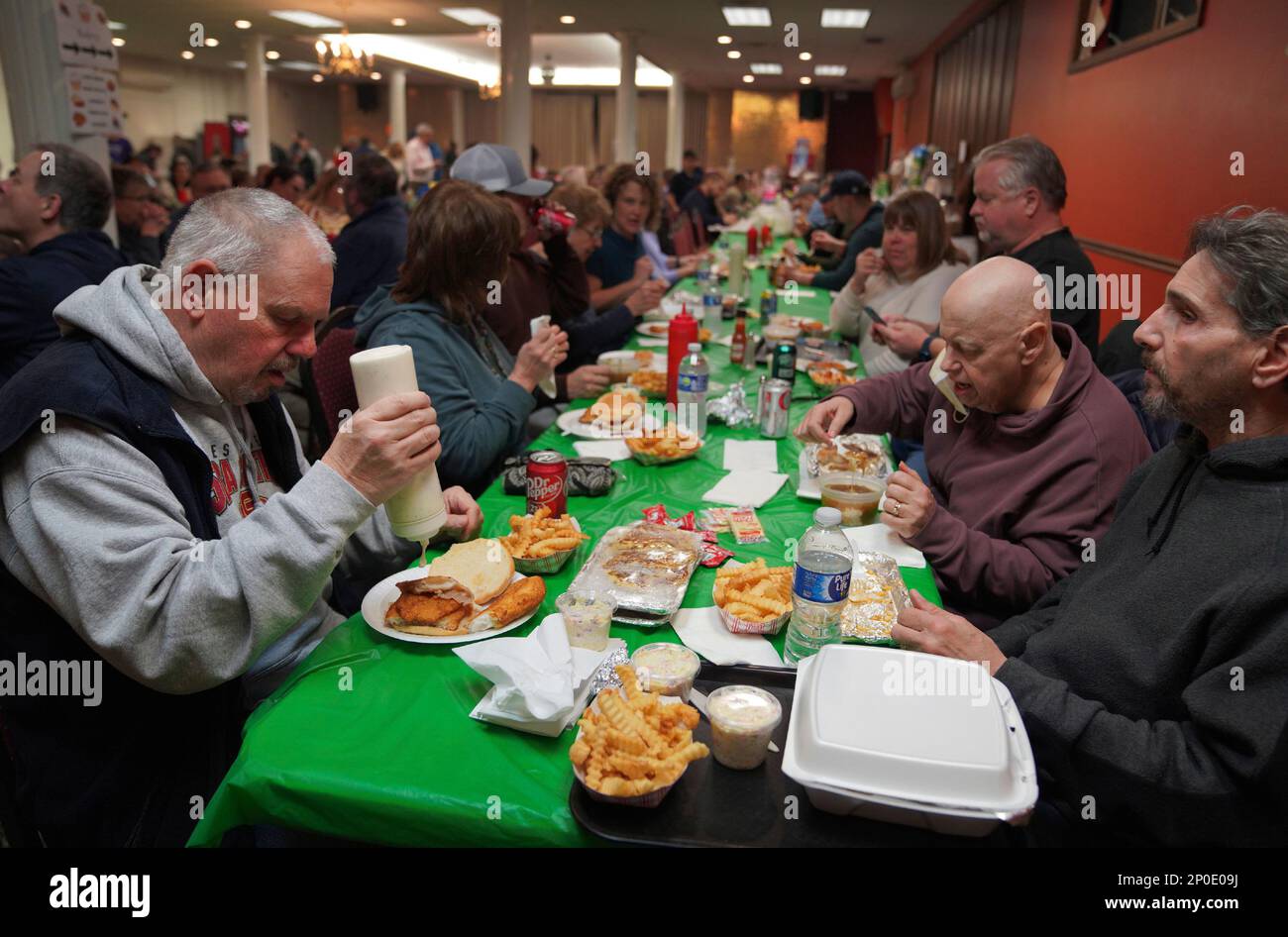Groups pack the basement of St. Maximilian Kolbe Catholic Church during ...