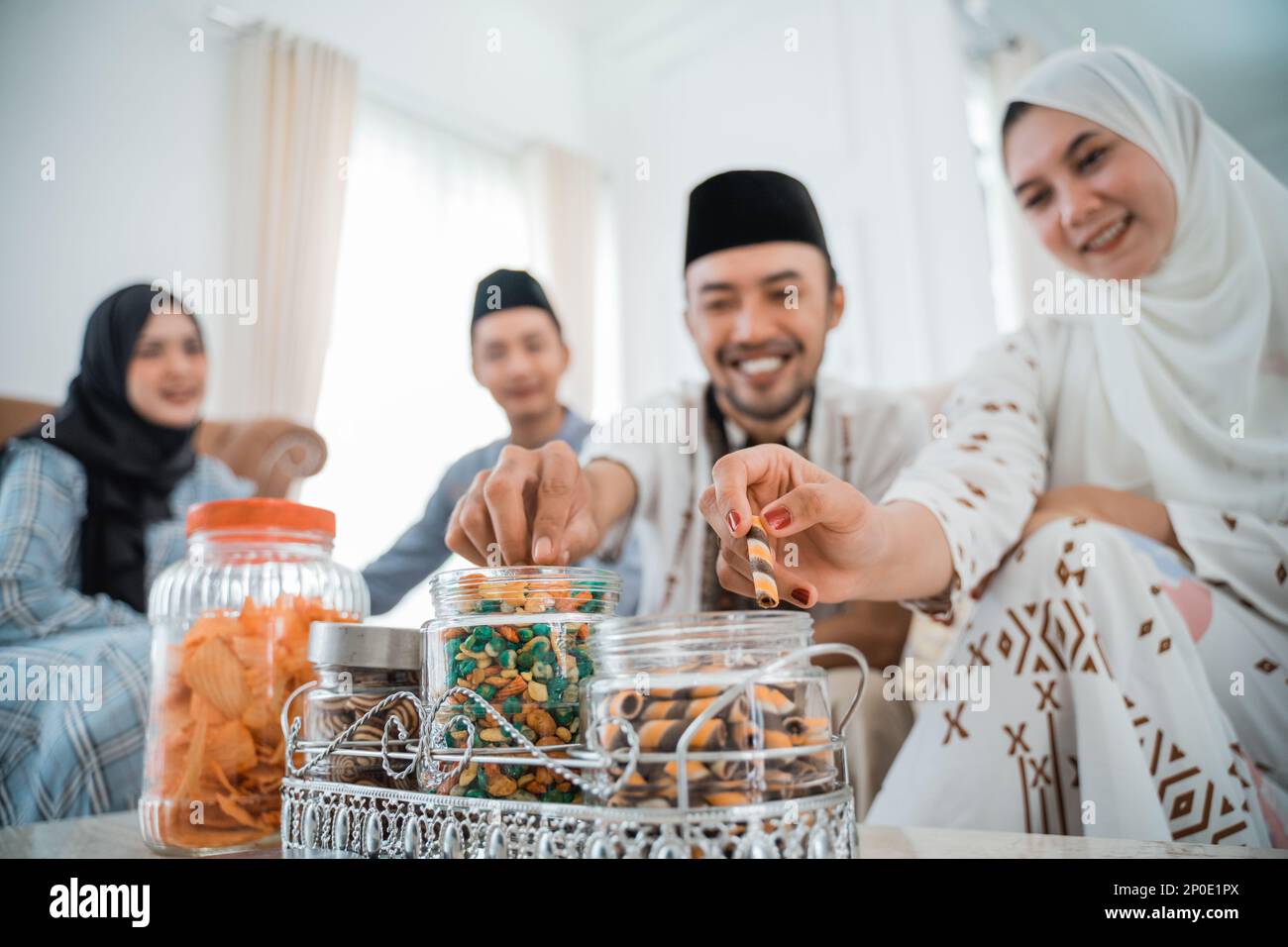 guests taking snacks from the jar during a visit Stock Photo - Alamy