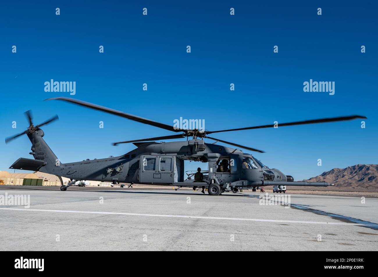 An HH-60W Jolly Green II helicopter from the 66th Rescue Squadron taxis ...